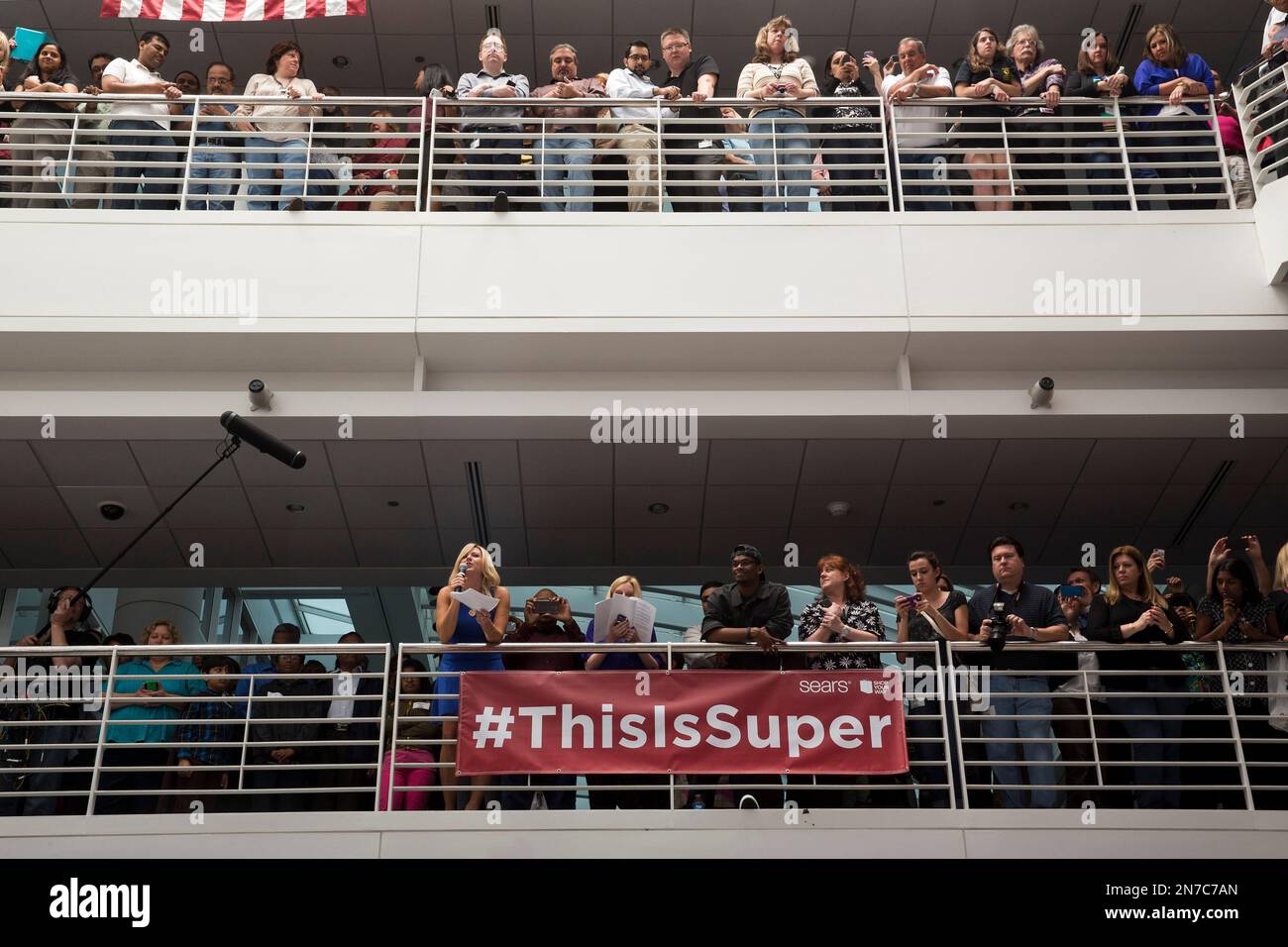 Kari Karch, emcee, addresses a crowd of Sears employees at the Sears ...