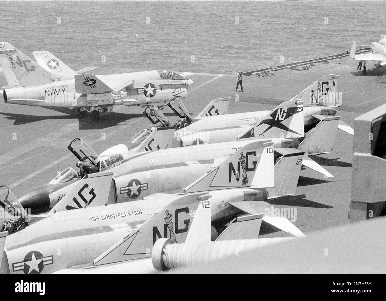 A Navy bomber moves into parking position on the deck of the USS ...