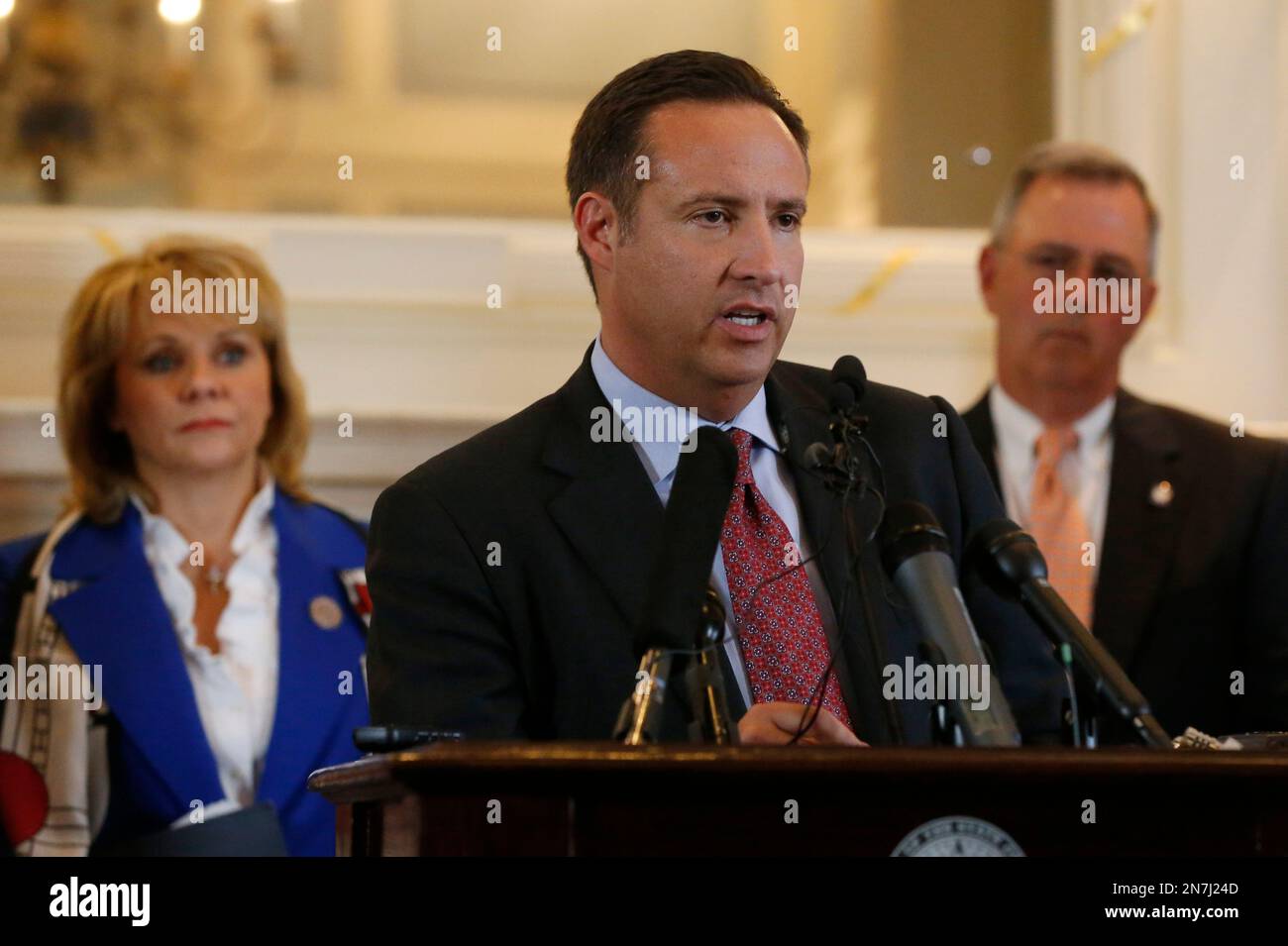 Preston Doerflinger, front, director of the Oklahoma Office of State ...