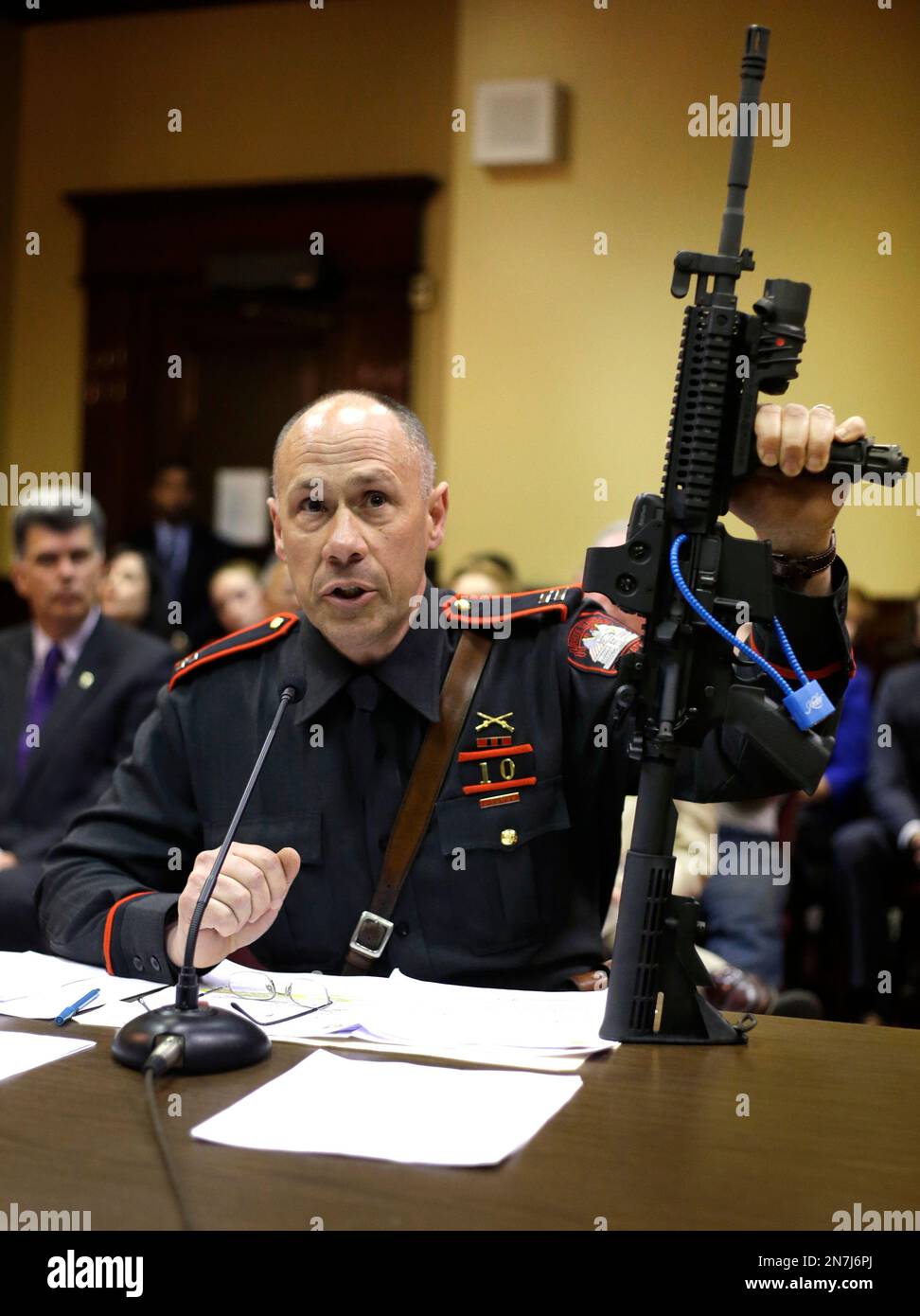 Rhode Island state police Capt. James Manni gives a demonstration using ...