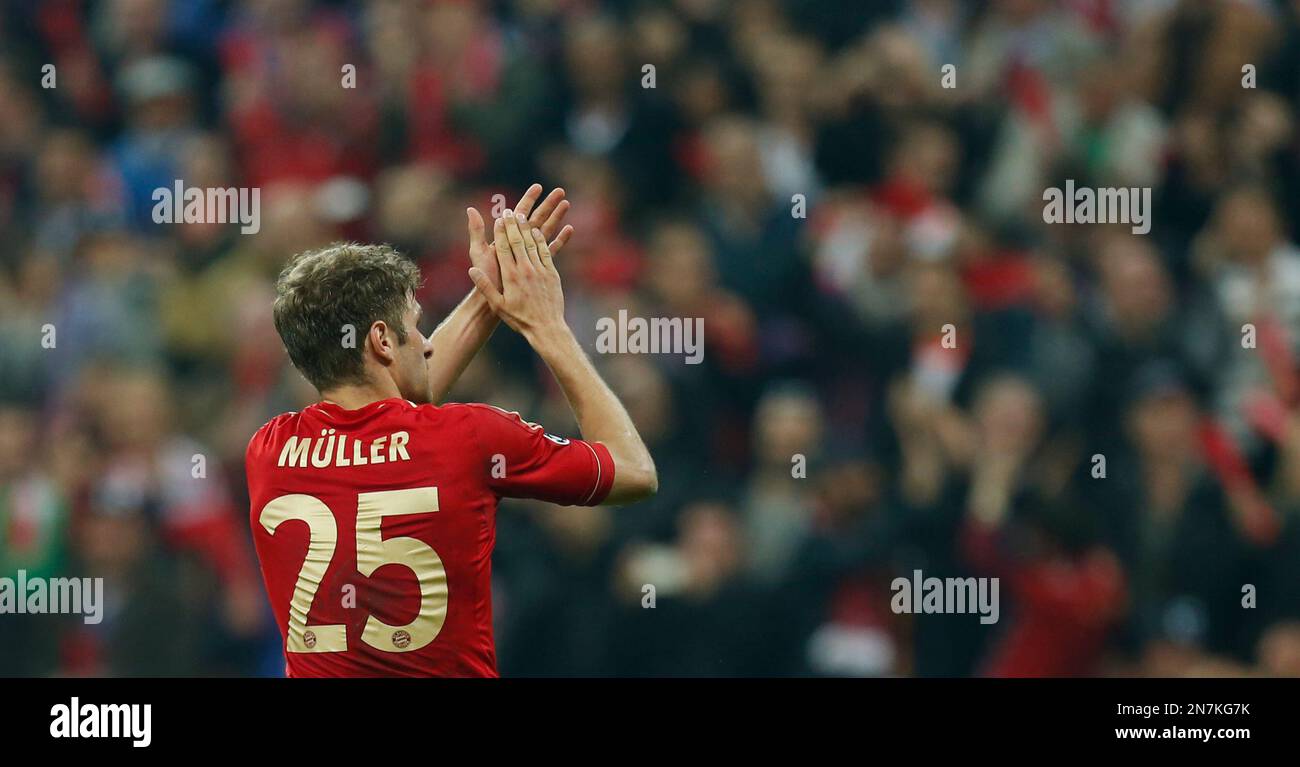 Bayern's Thomas Mueller aplaudes to supporters during the Champions ...