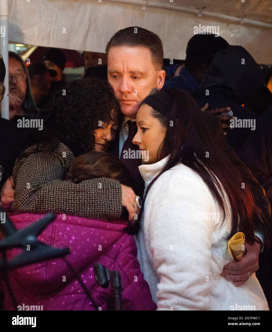 Mingo County Commissioner Greg "Hootie" Smith, center, embraces the ...