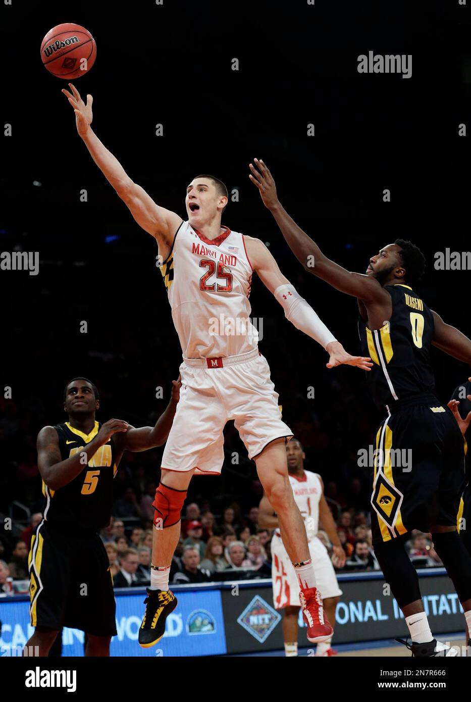 Maryland's Alex Len (25) drives past Iowa's Anthony Clemmons (5) and ...