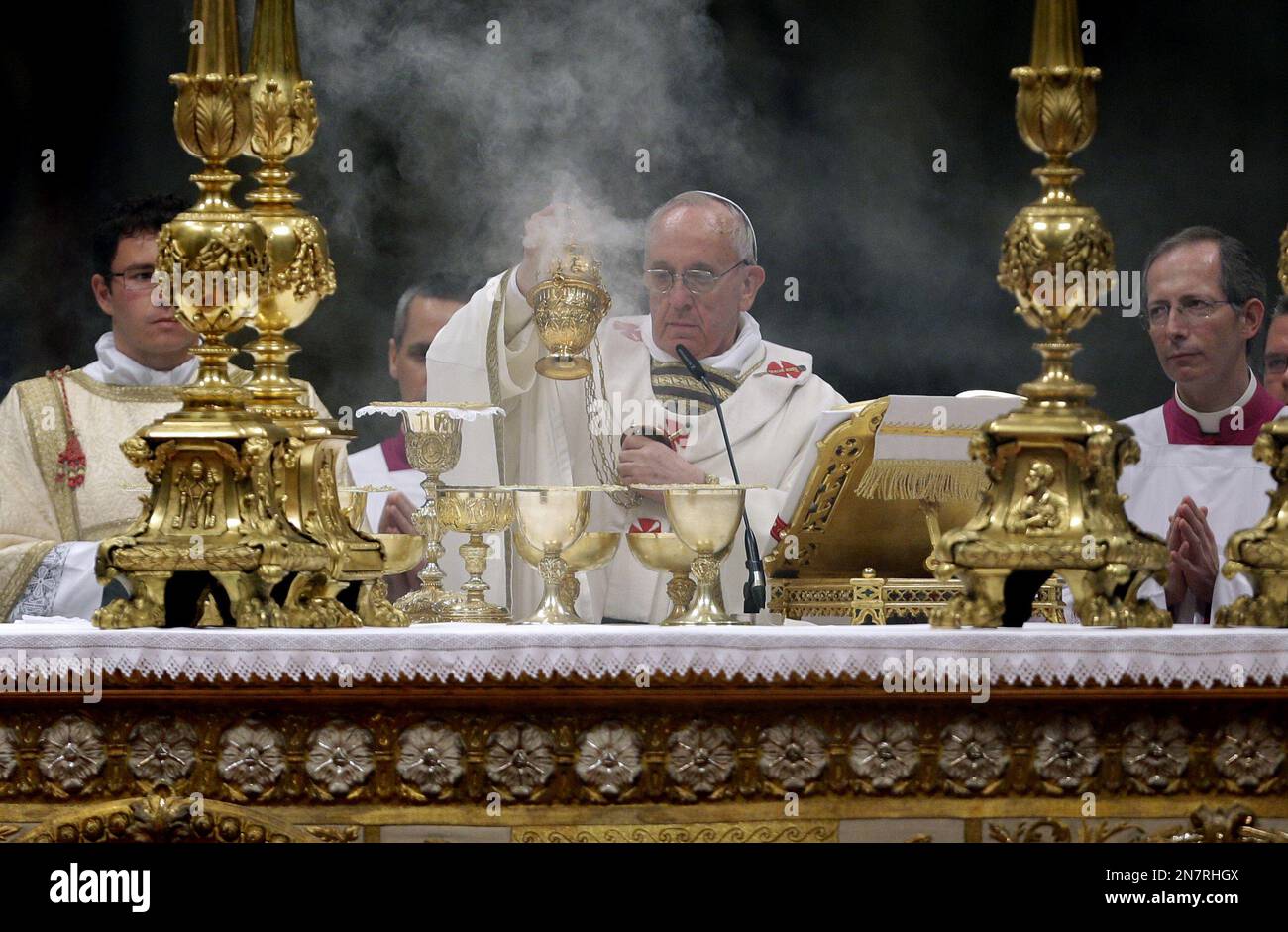 Pope Francis leads the Easter vigil service in St. Peter's Basilica, at ...