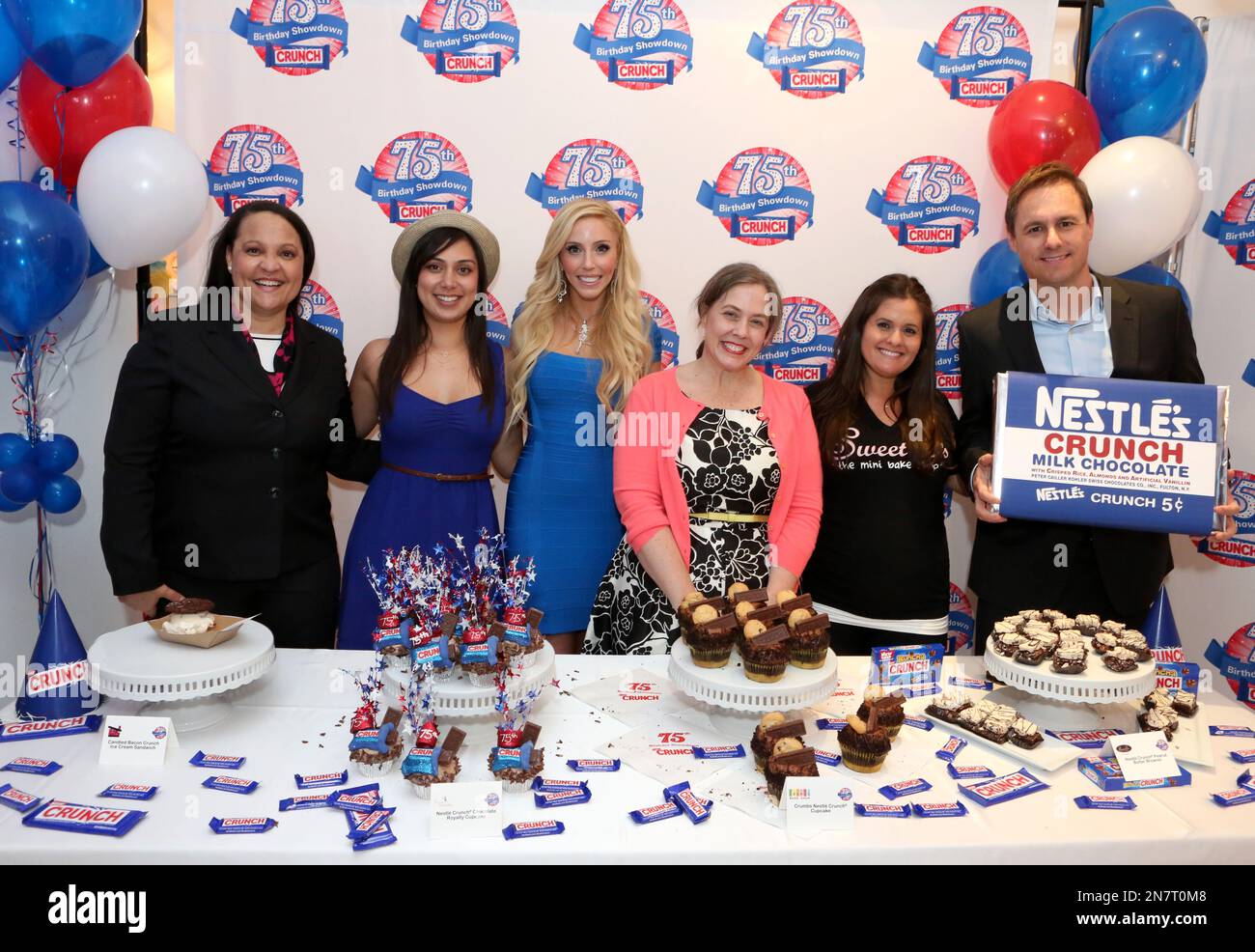 From left, Tricia Bowles, Nestle Crunch spokesperson, Nastassia Johnson ...