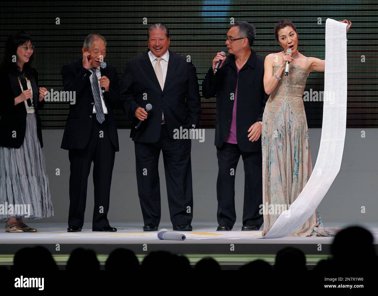 Malaysian actress Michelle Yeoh, right, displays a long list of people ...