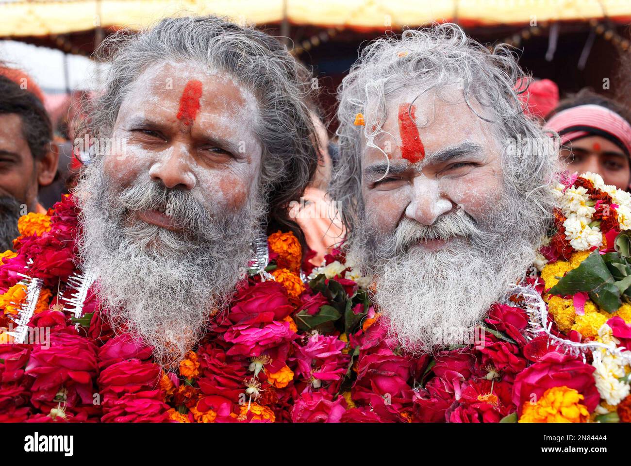 Hindu holy men of Niranjani akhada or sect pose for photographs as they ...