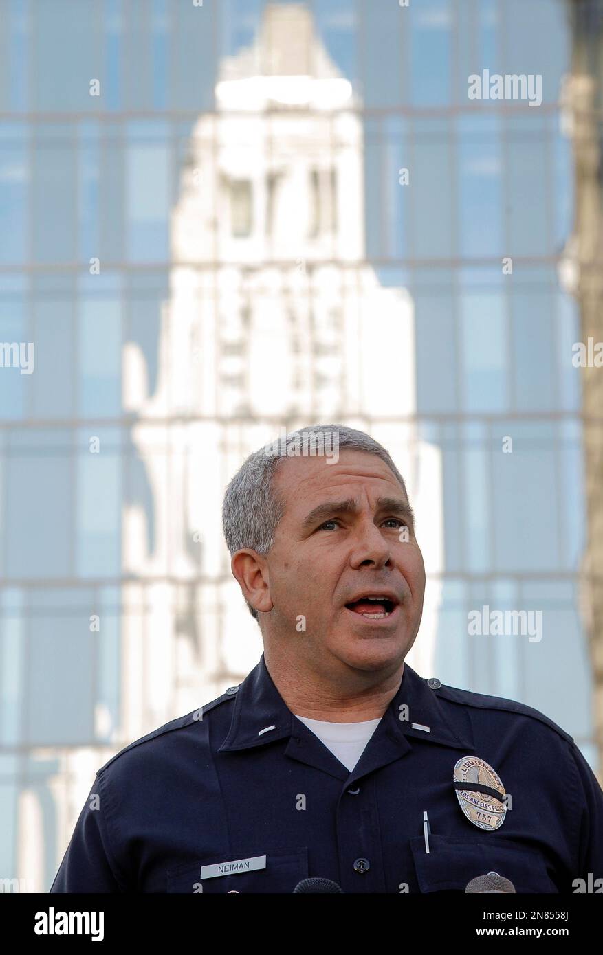 Los Angeles police Lt. Andrew Neiman, left, takes questions from the ...