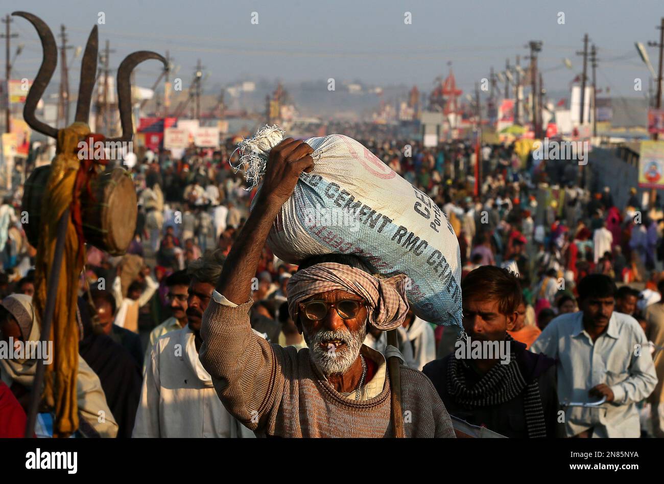 Indian devotees arrive for a holy dip at Sangam, the confluence of the ...