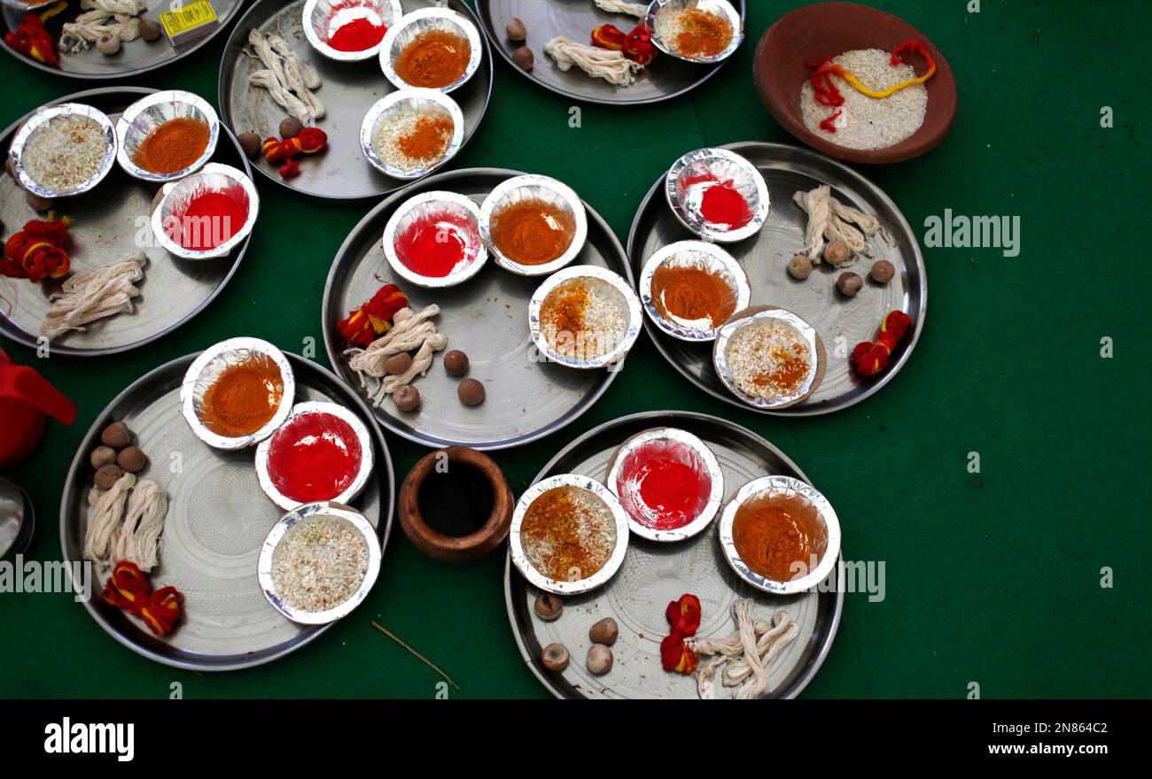 Food is displayed on a steel tray during a consecration ceremony for ...