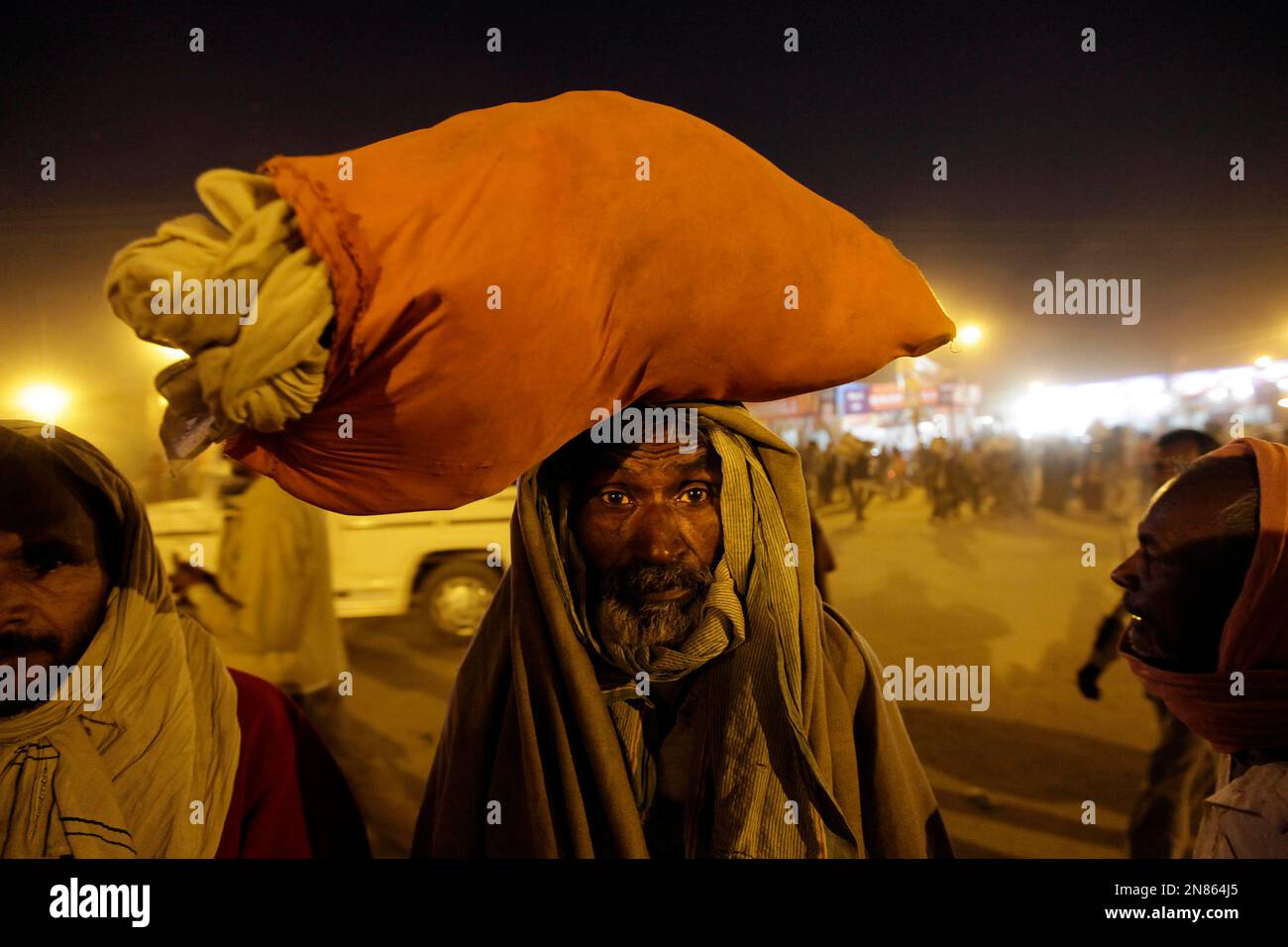 Indian Hindu devotees arrive at Sangam, the confluence of the Rivers ...