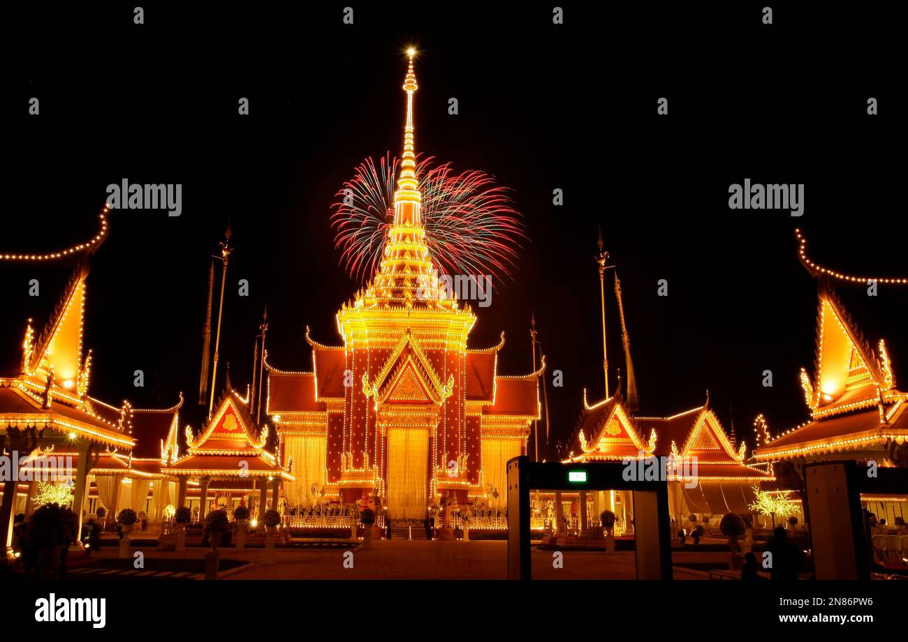 Fireworks explode in front of the cremation site ahead of Cambodia's ...