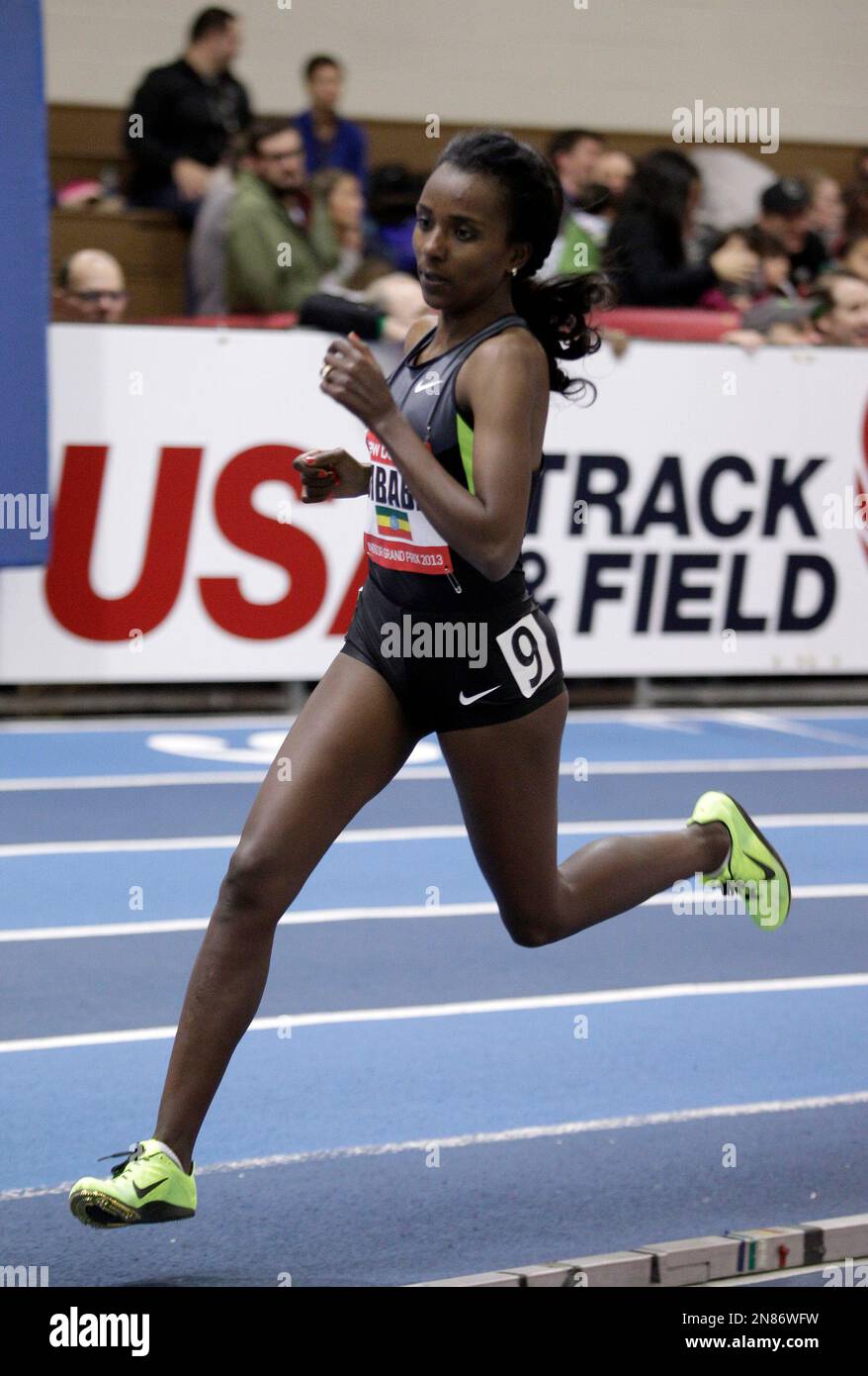 Tirunesh Dibaba, of Ethiopia, strides to win the women's two-mile race ...