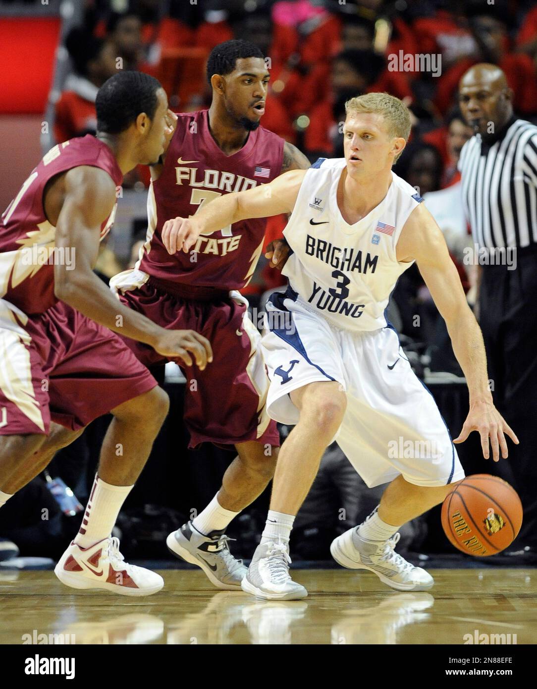 Florida State's Michael Snaer (21) and Terry Whisnant II (31) guard ...
