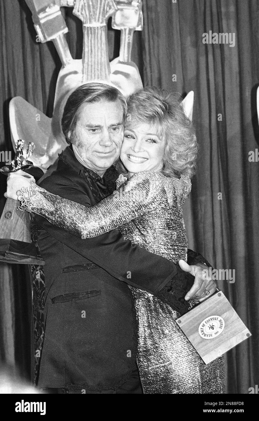 Singer George Jones, left, winner of three Country Music Awards, hugs ...