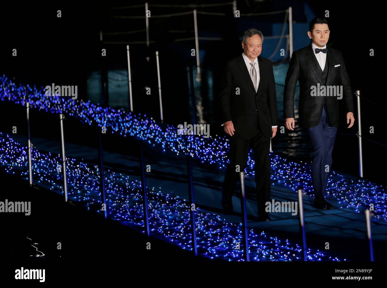 Director Ang Lee, left, and Japanese actor Masahiro Motoki arrive at ...