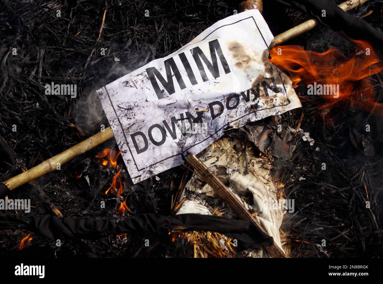 A placard and a burnt effigy of Majlis-e-Ittehadul Muslimeen (MIM ...