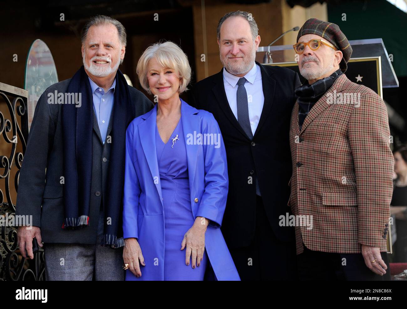 British actress Helen Mirren, second from left, poses with her husband ...