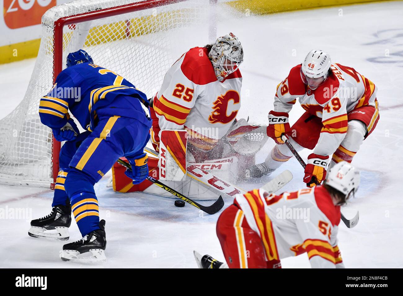 Calgary Flames goalie Jacob Markstrom (25) stops a shot by Buffalo Sabres right wing Kyle Okposo ...