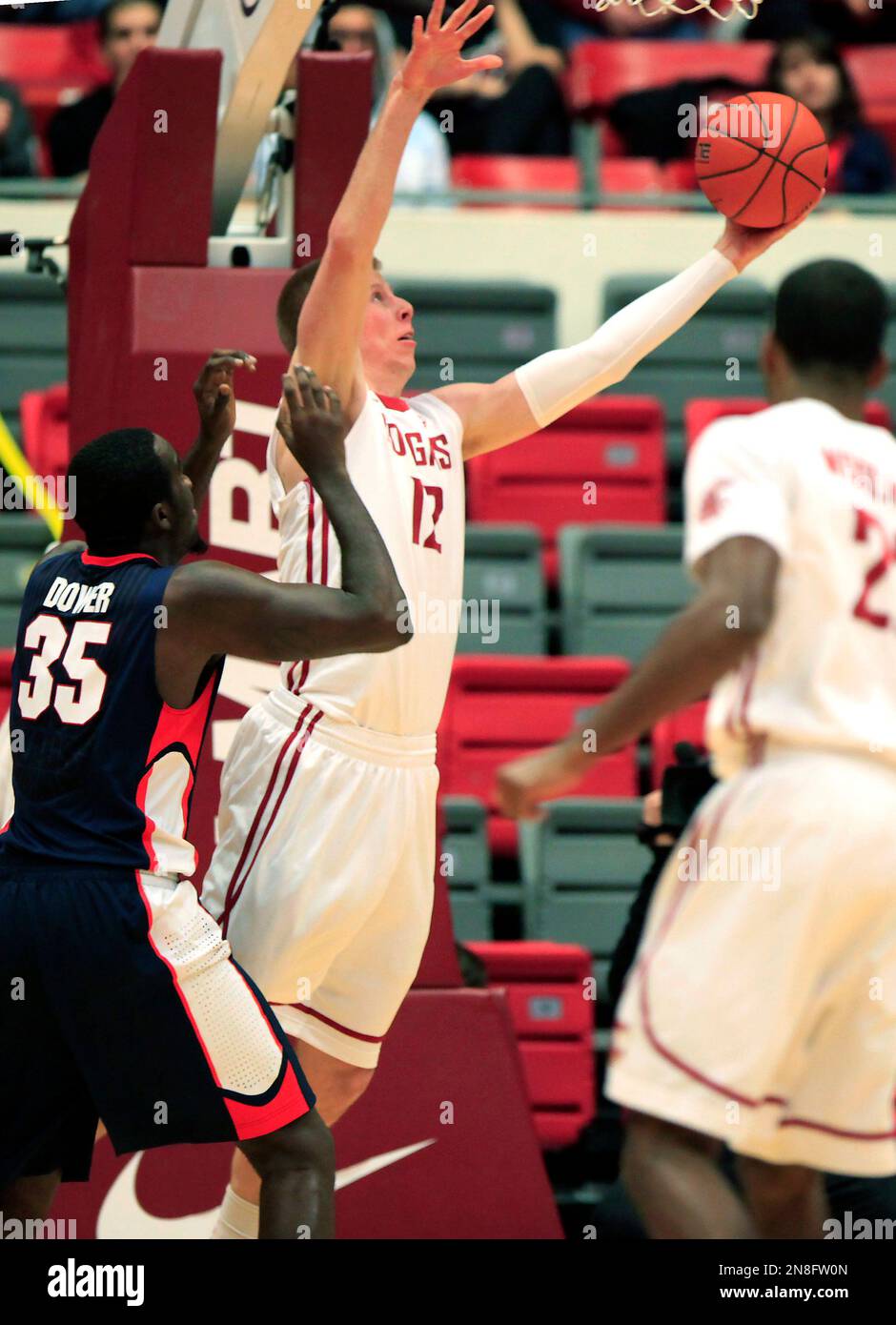 Washington State forward Brock Motum (12) lays in a reverse layup after ...