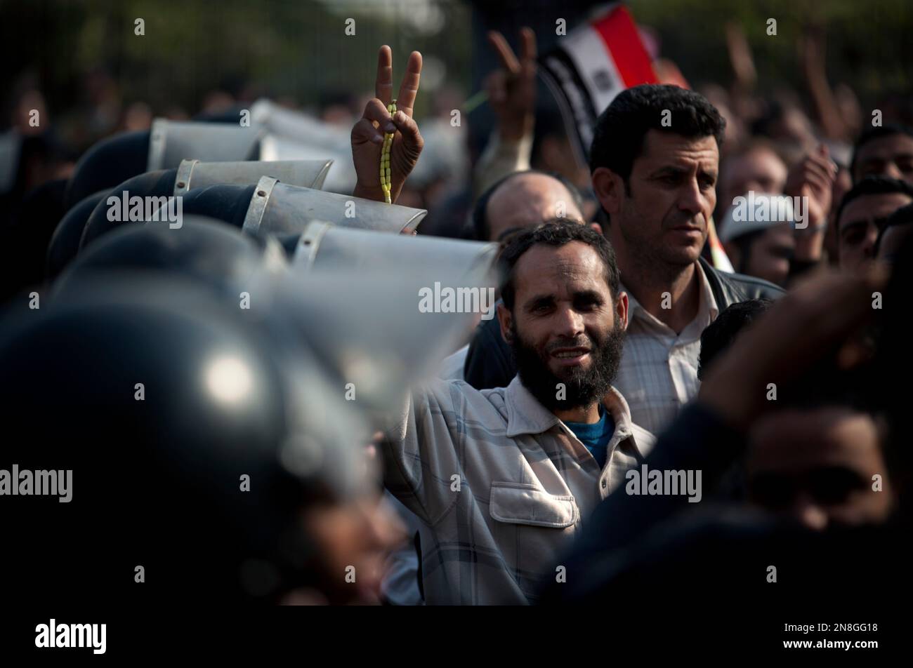A Supporter of Egyptian President Mohammed Morsi flashes the Victory ...