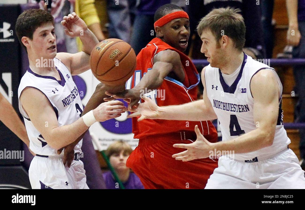 Delaware State guard Amere May, center, loses control of the ball to ...