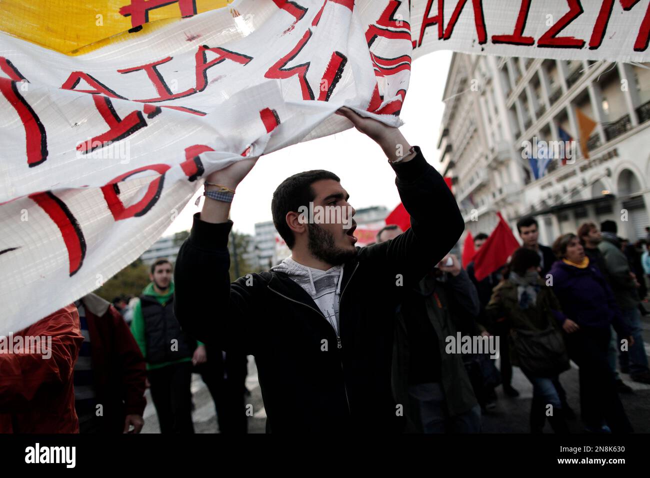 Protesters chant slogans during a rally in Athens on Saturday, Nov. 17 ...