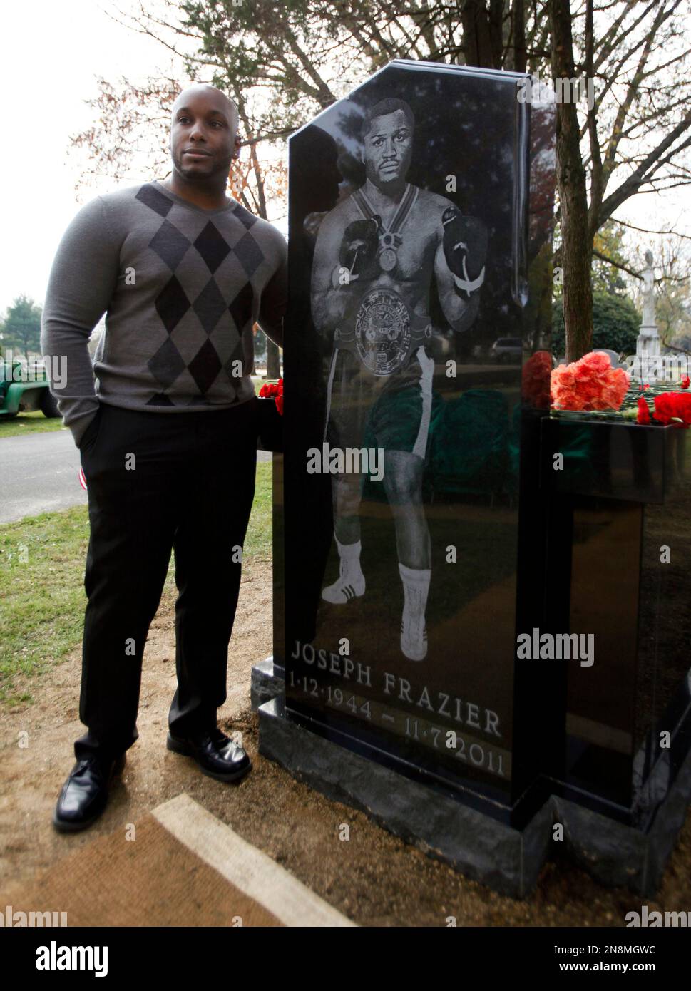 Joe Frazier Jr. stands beside his father's crypt following an unveiling ...