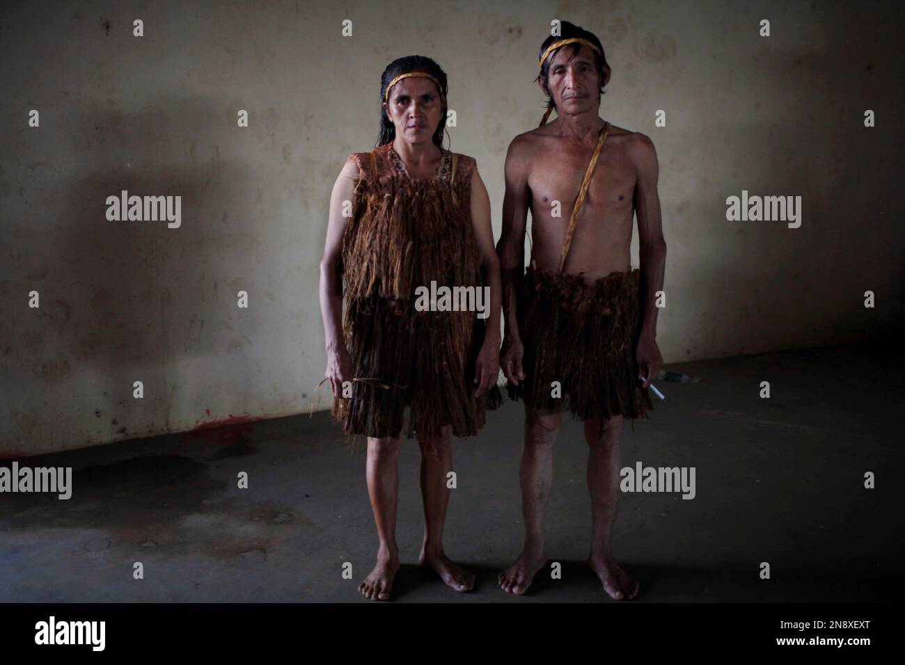 An Esse Ejja indigenous couple poses for a portrait before getting ...