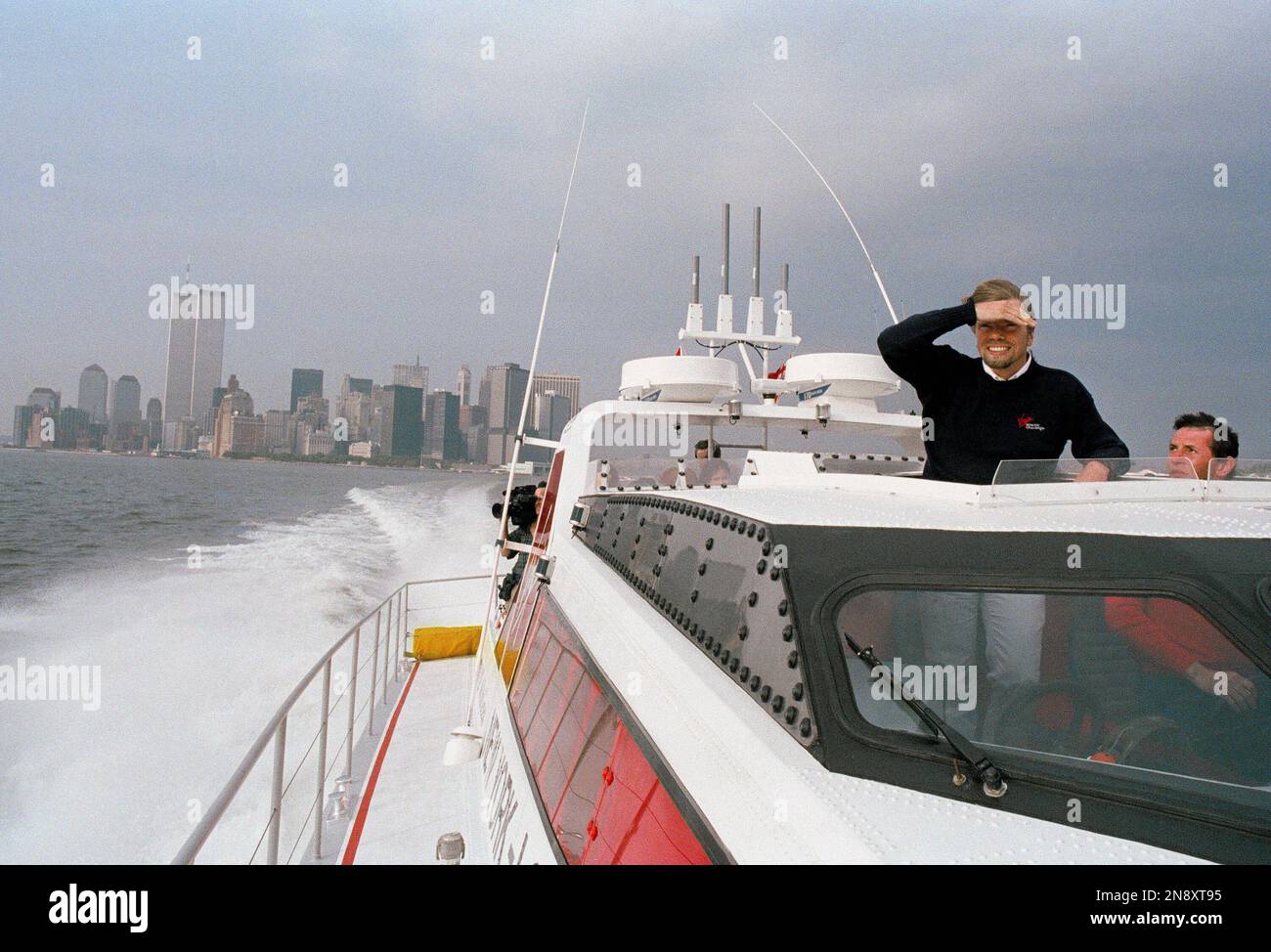 Richard Branson pilots his speedboat, the Virgin Atlantic Challenger II ...