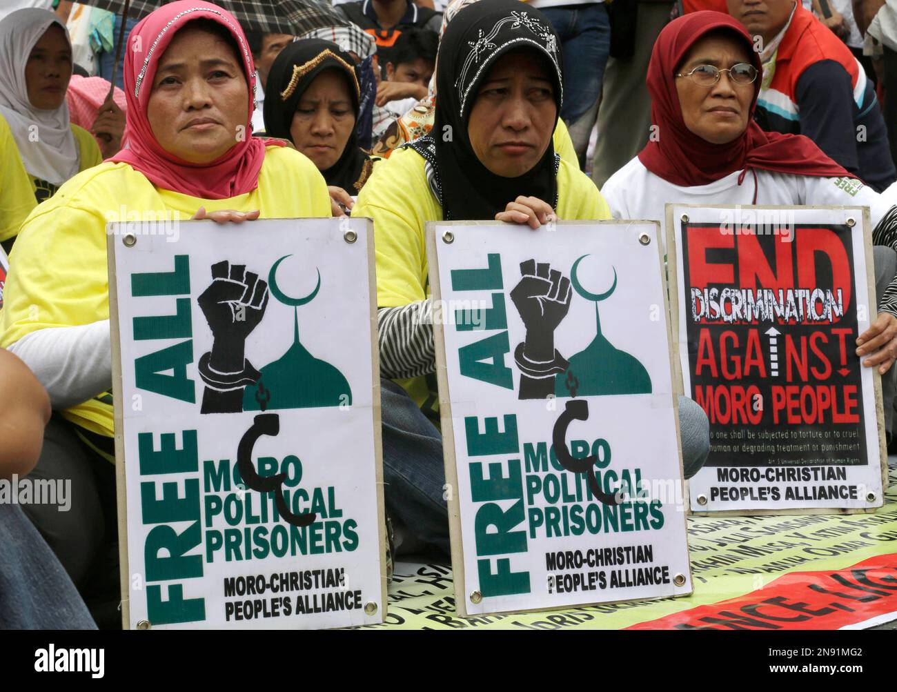 Filipino Muslims display placards during a rally near the Presidential ...