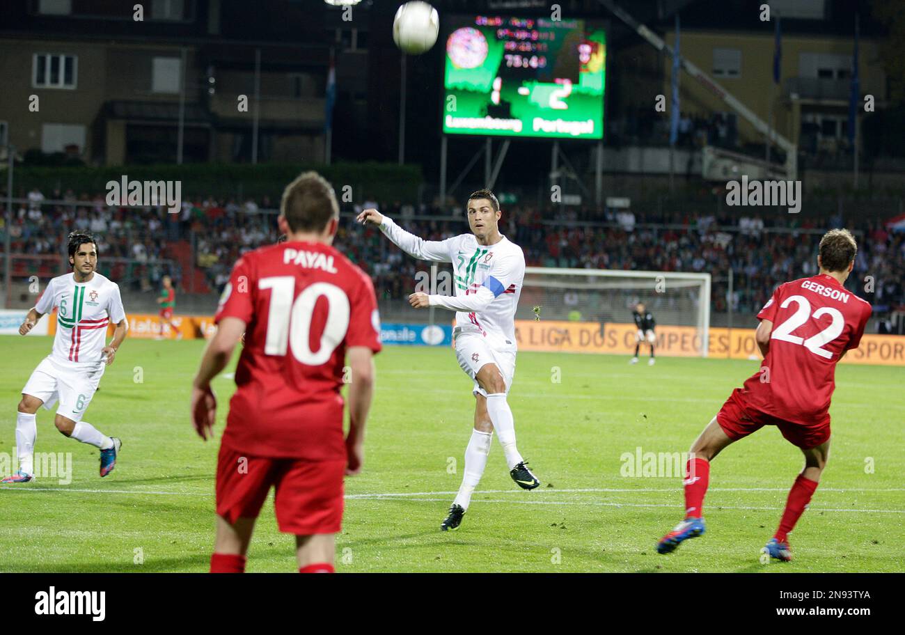 Portugal's Cristiano Ronaldo, right, shoots against Luxembourg's Ben ...