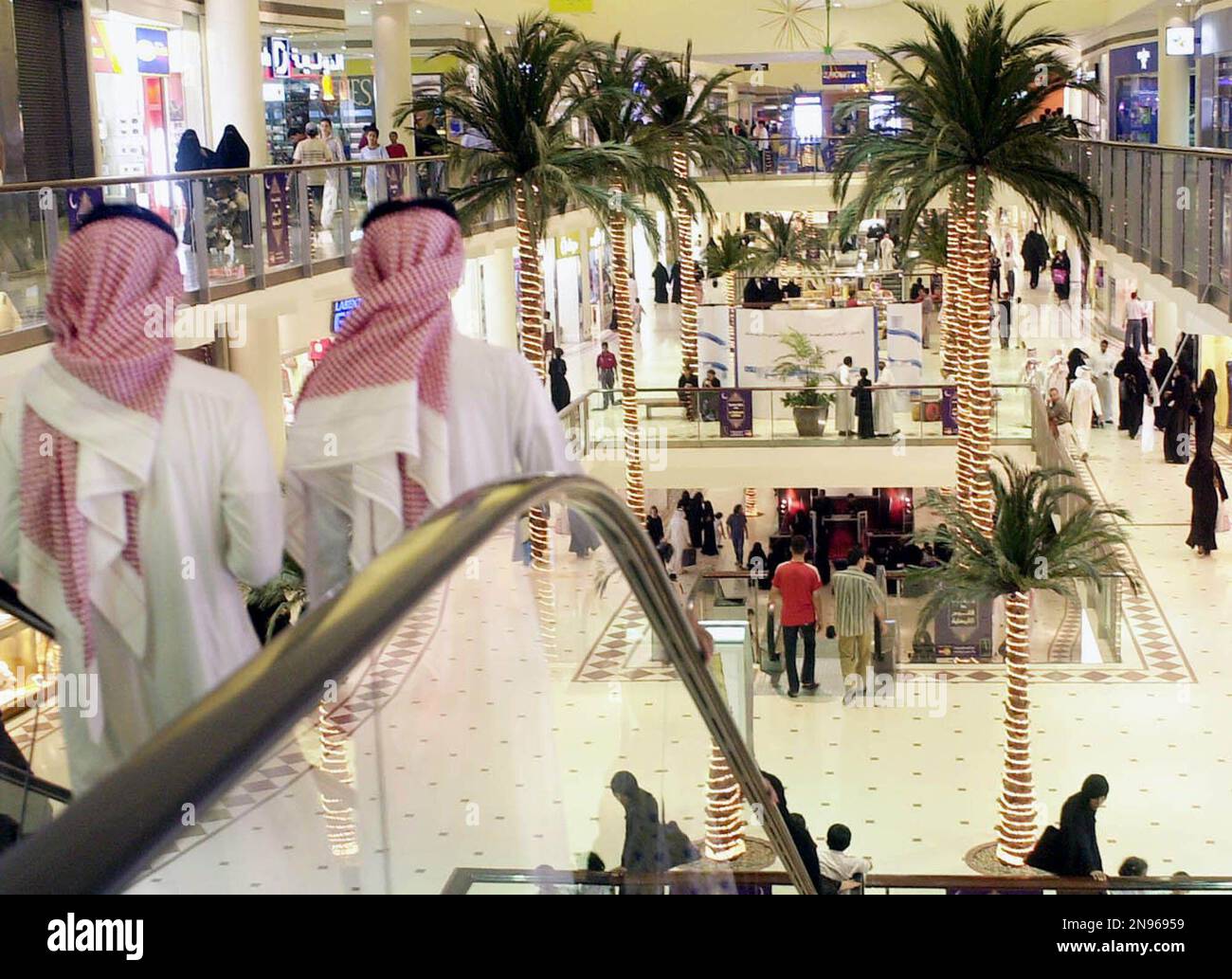 Saudis stroll in a shopping mall in Riyadh, Saudi Arabia, on Friday Oct ...
