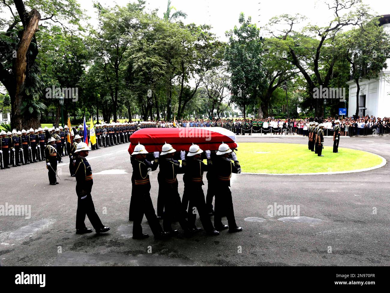 Presidential guards carry the flag-draped coffin of the late Interior ...