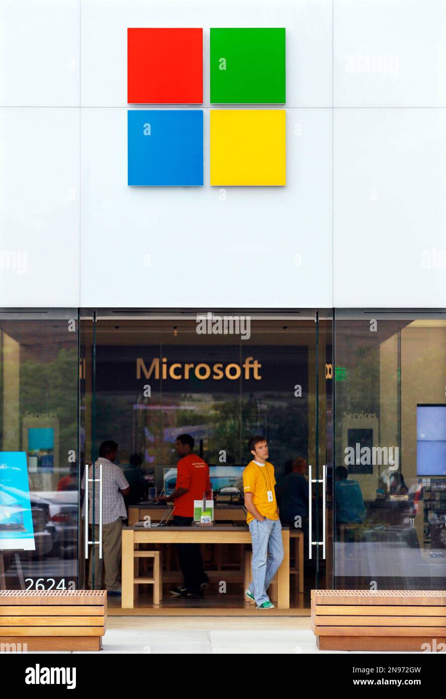 The new Microsoft logo is seen above the entrance to a company store ...
