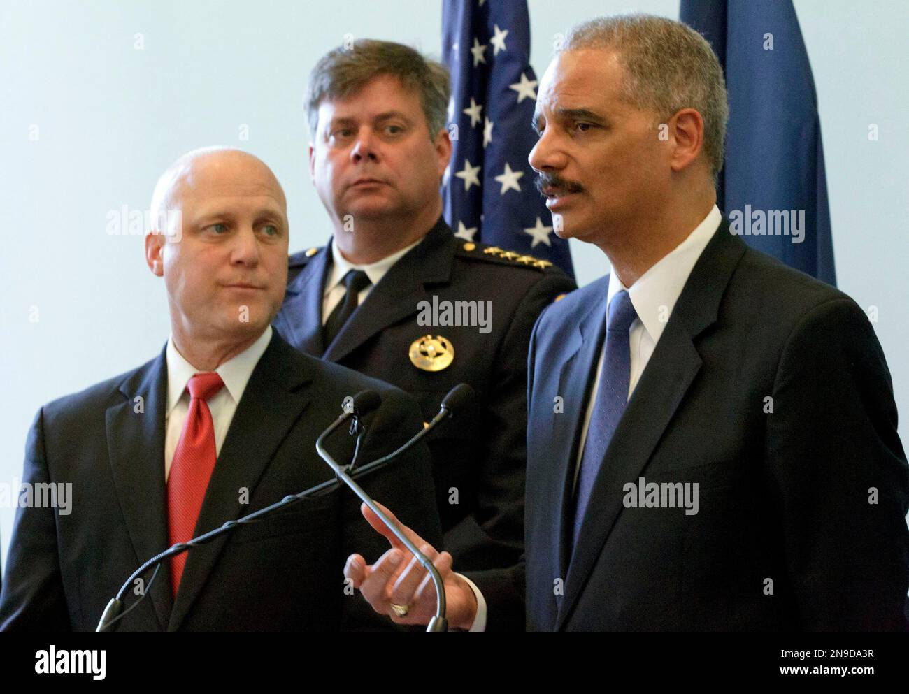 U.S. Attorney General Eric Holder speaks next to New Orleans Mayor ...