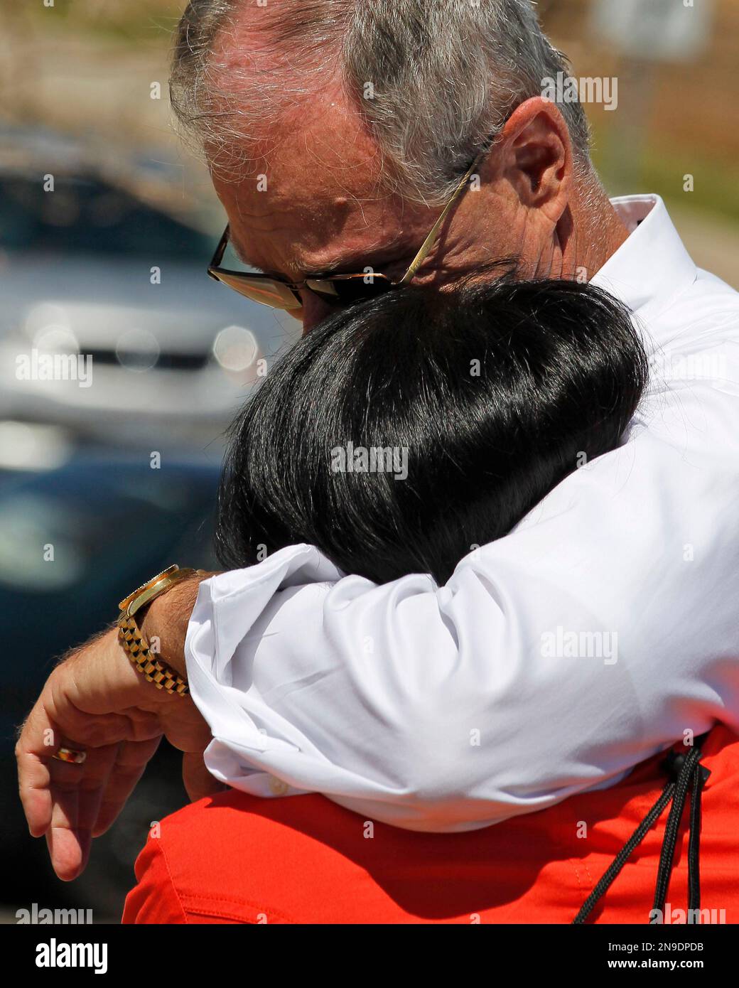 Aurora, Colo. Mayor Steve Hogan, hugs his wife Becky Hogan after ...