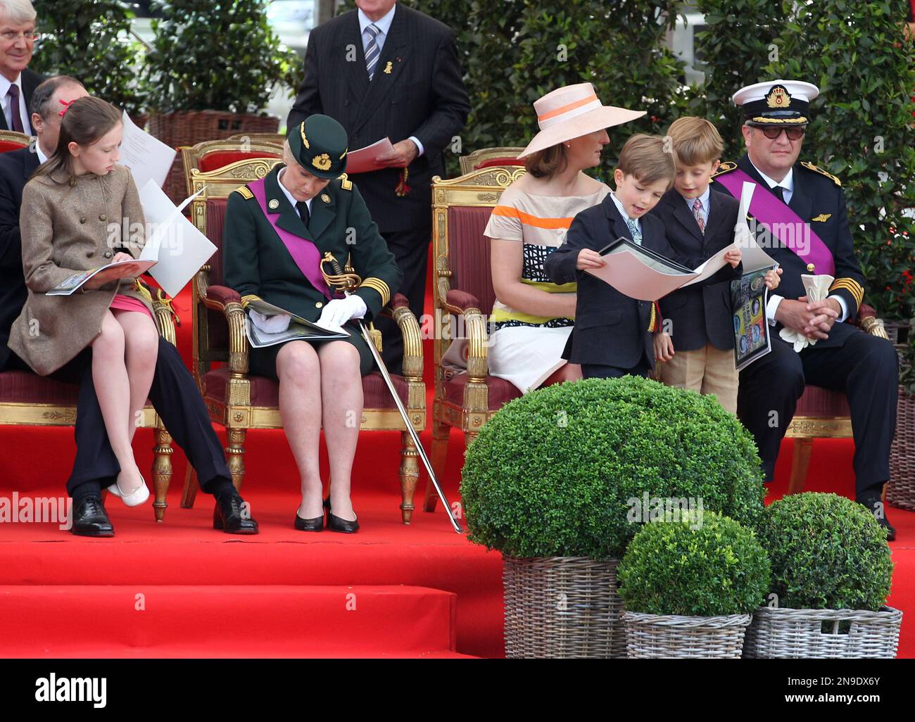Belgium's Prince Nicolas, right, and his twin brother Aymeric, look at ...