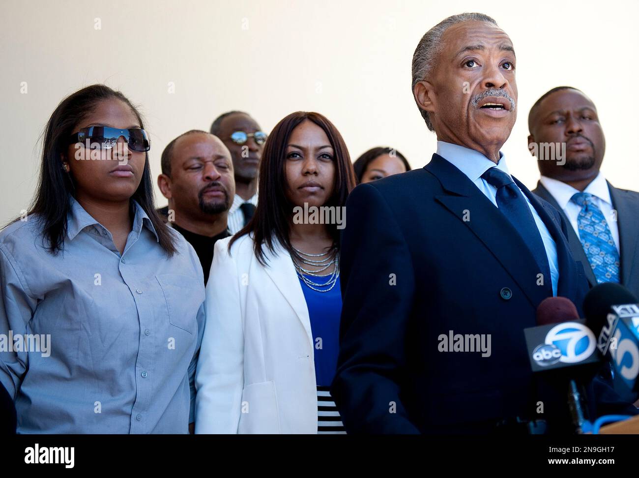 The Rev. Al Sharpton, foreground right, speaks to the reporters before ...