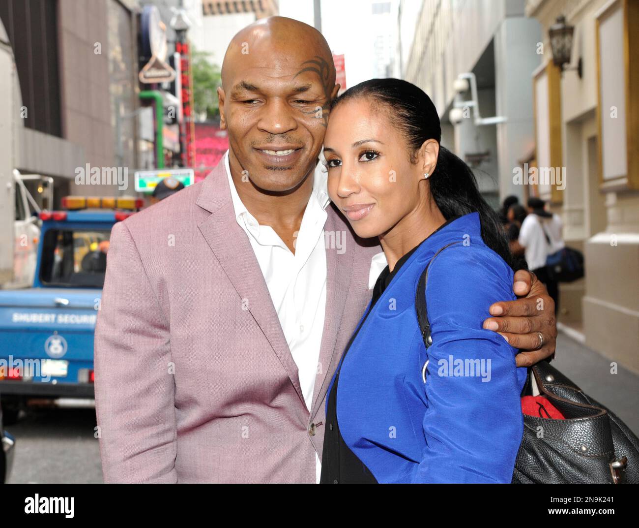 Former heavyweight boxer Mike Tyson and wife Kiki Tyson pose together ...