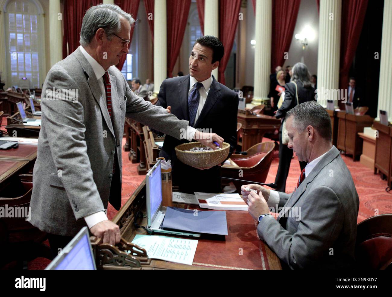State Sen. Michael Rubio, D-Bakesfield, center, passes out candy to ...