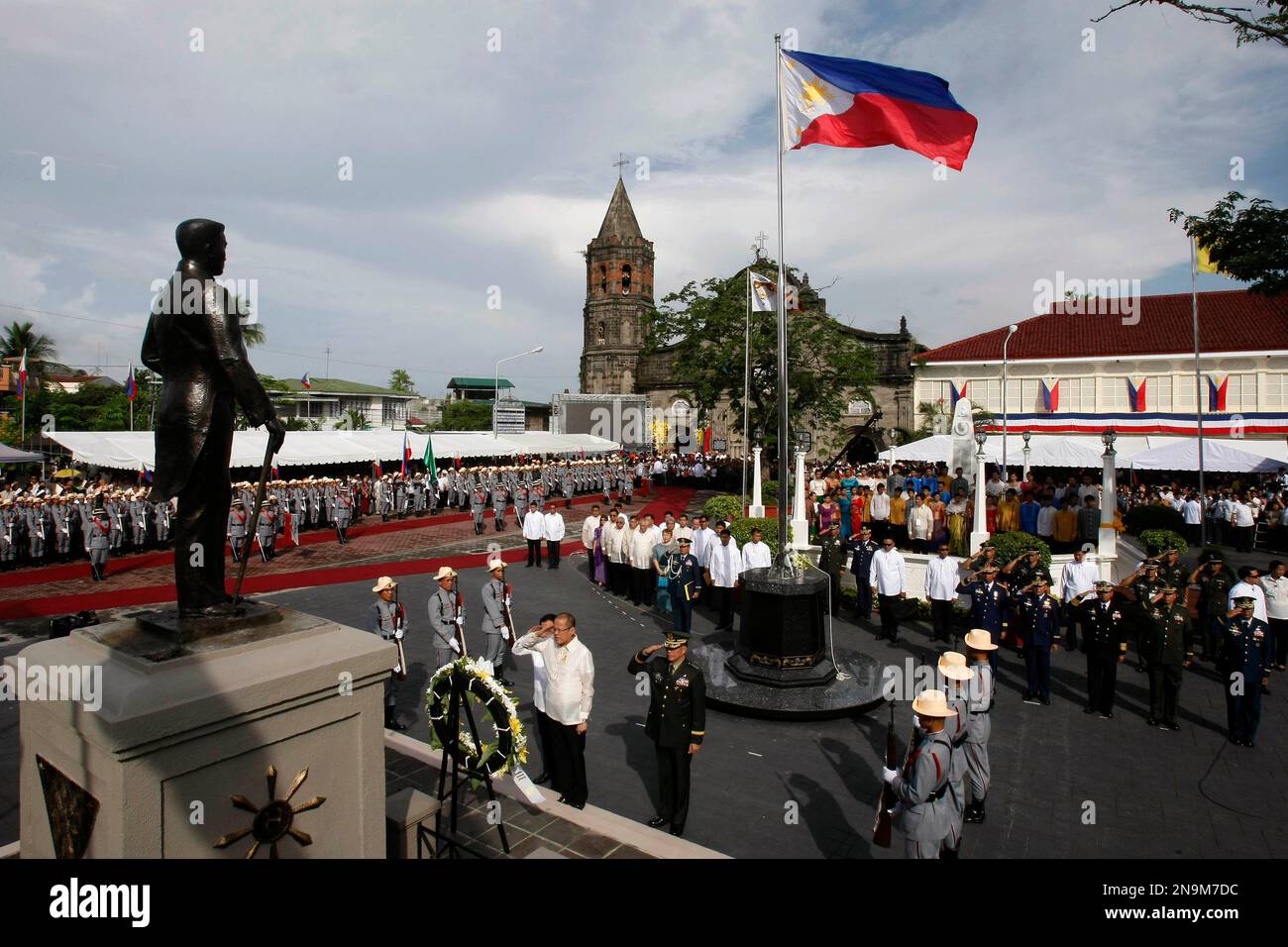 Philippine President Benigno Aquino III, center front, salutes the ...
