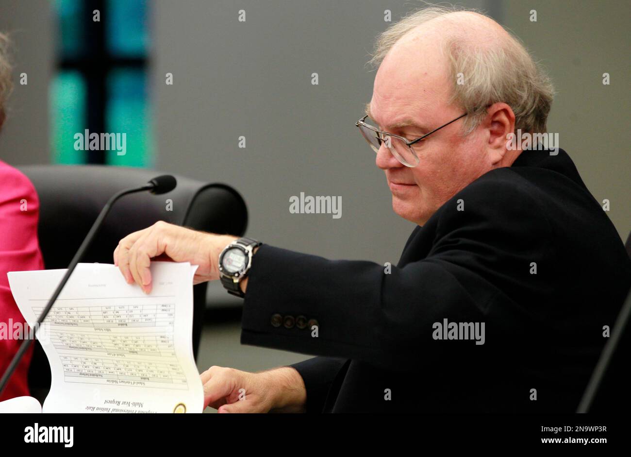 College Board member Alan Perry studies the new college tuition ...