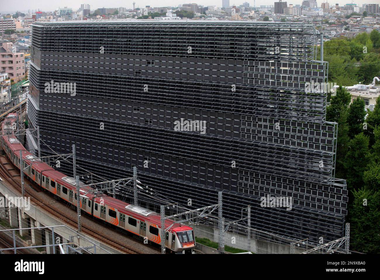 In this Tuesday, May 1, 2012 photo, a commuter train passes by a new ...