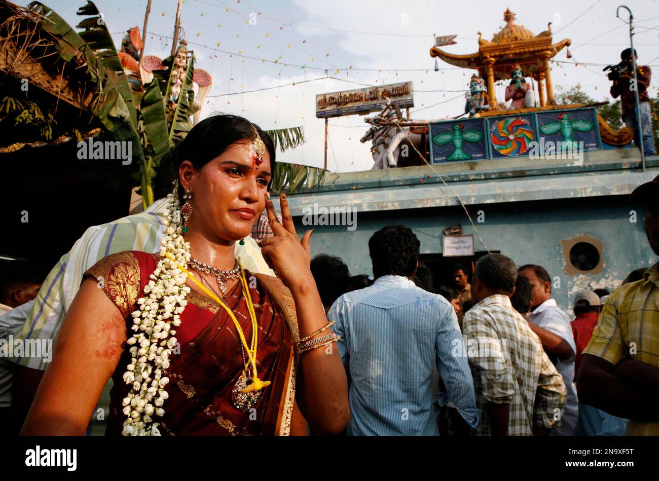 In this Tuesday, May 1, 2012 photo, an Indian eunuch comes out a temple ...