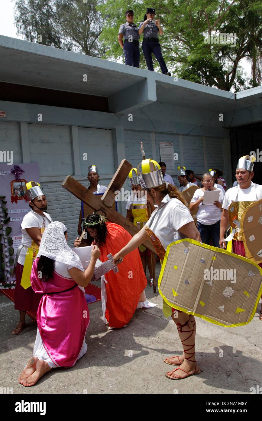 Prison guards, top, record video as female inmates reenact the Passion ...