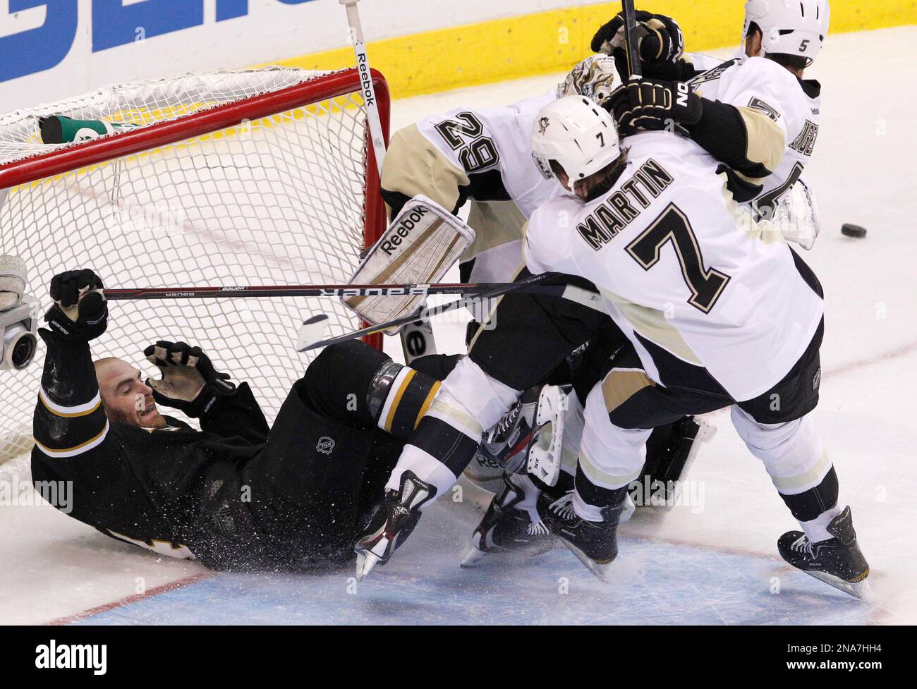Dallas Stars left wing Eric Nystrom, left, is knocked into the net by ...