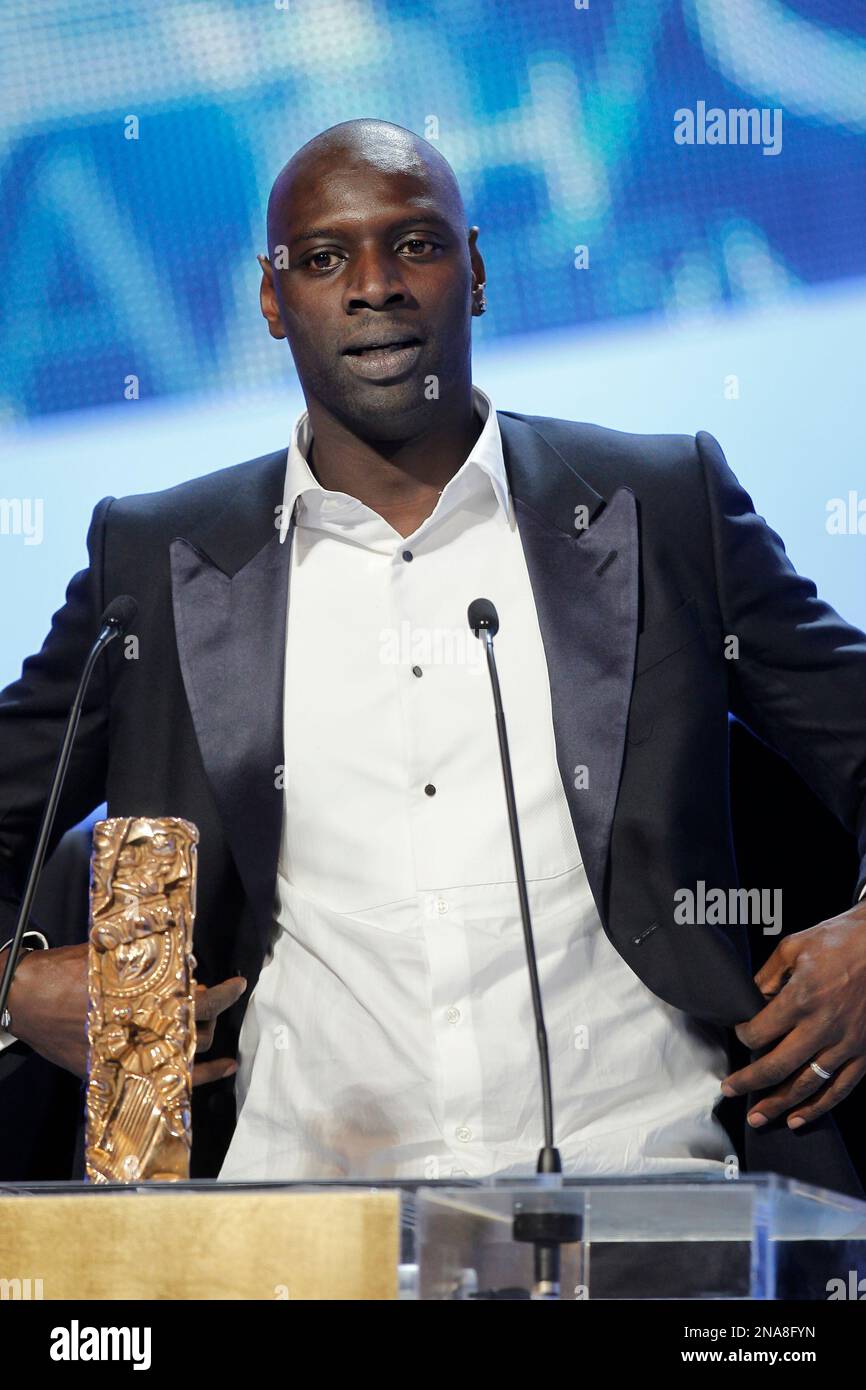 French actor Omar Sy reacts 0n stage after is awarded Best Actor award ...