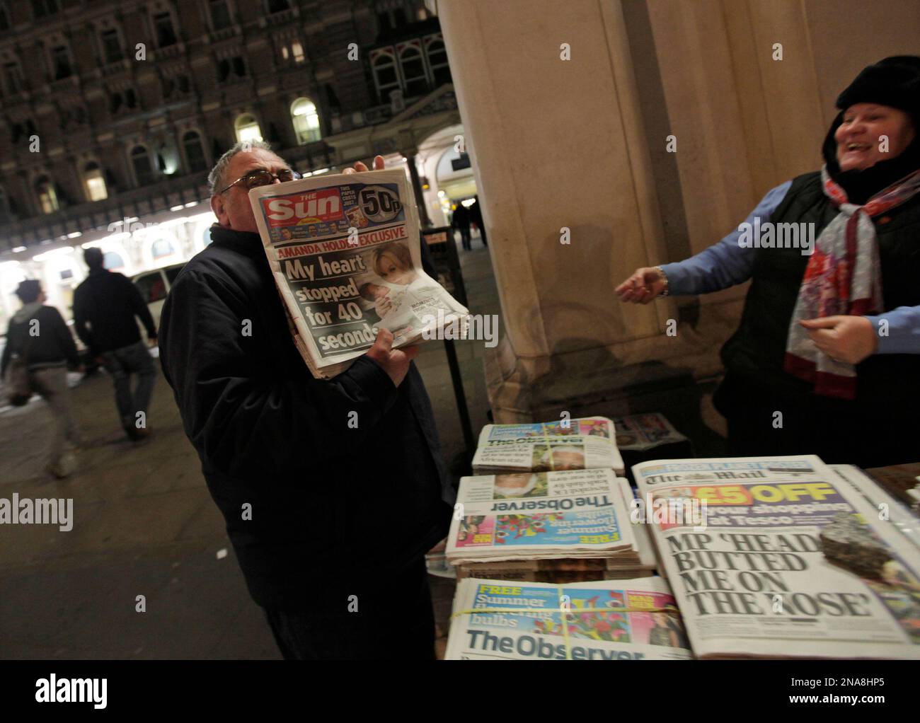 Copies of the newly published The Sun on Sunday weekly tabloid are seen ...