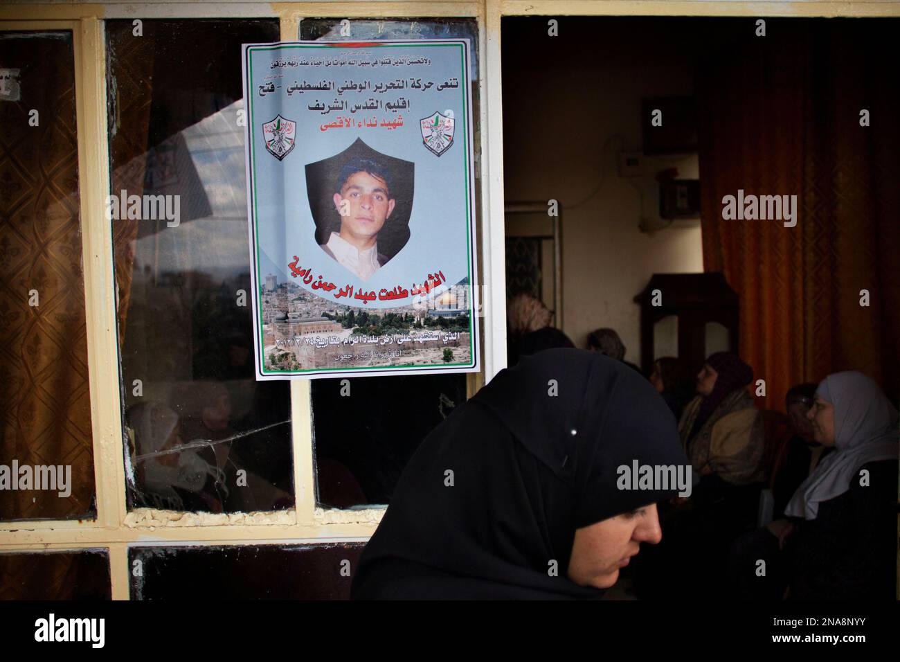 Palestinian woman mourn in the family house of Talat Ramia during his ...